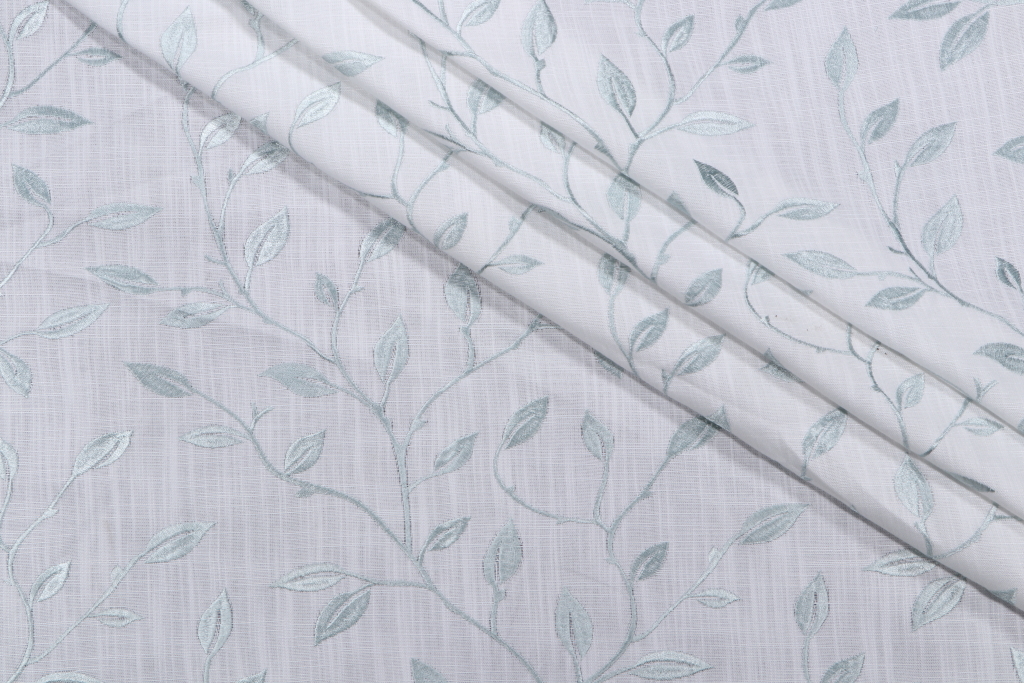 Valiant Fabrics Capri Embroidered Polyester Drapery Fabric in Cloud Blue